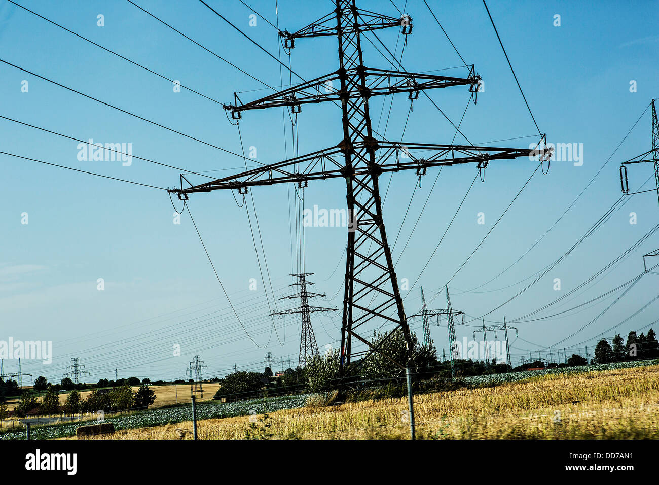High Voltage pylons, electricity division, distribution Stock Photo - Alamy