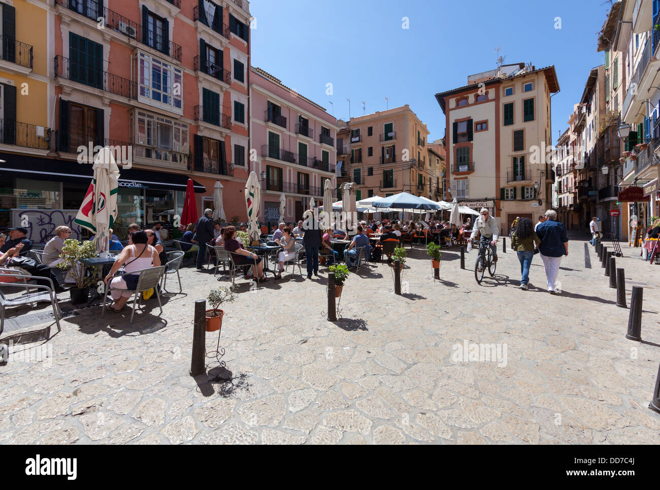 Spain, Mallorca, Palma, People sitting in cafe at Plaza de Salvador ...