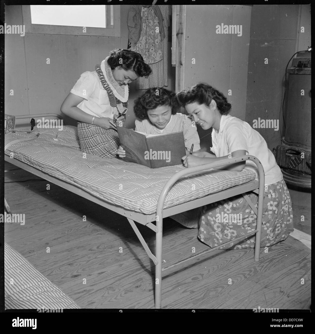 This photograph captures three young women at the closing of the Jerome ...