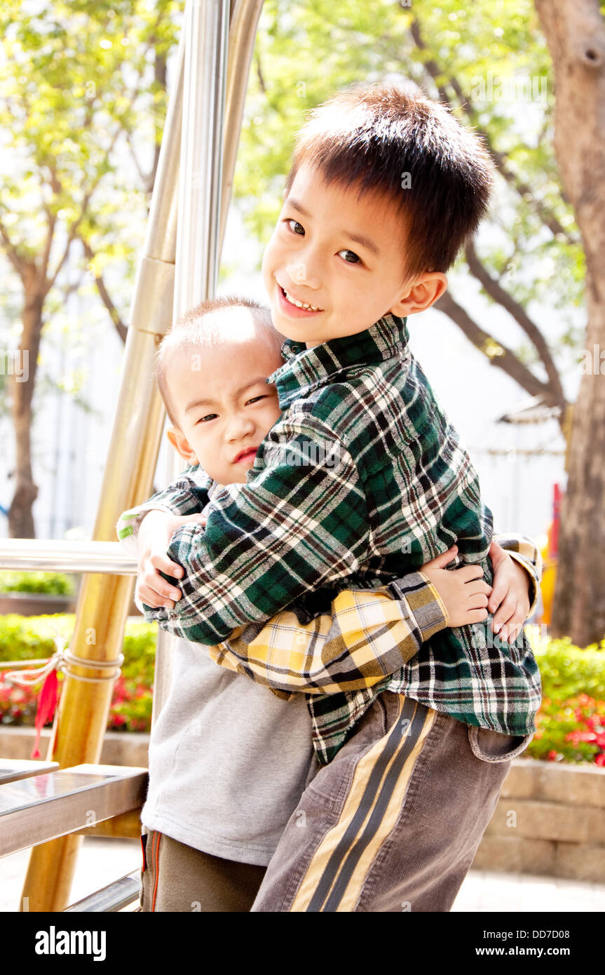 Hug asia friendship hi-res stock photography and images - Alamy