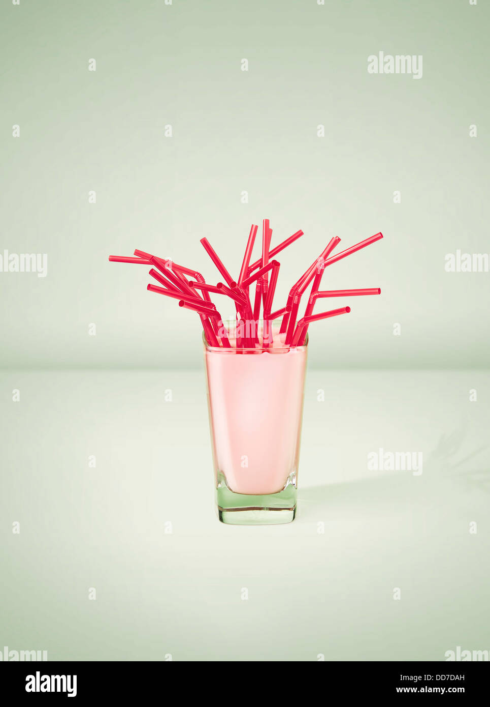 Strawberry milk shake with multiple straws for sharing Stock Photo - Alamy