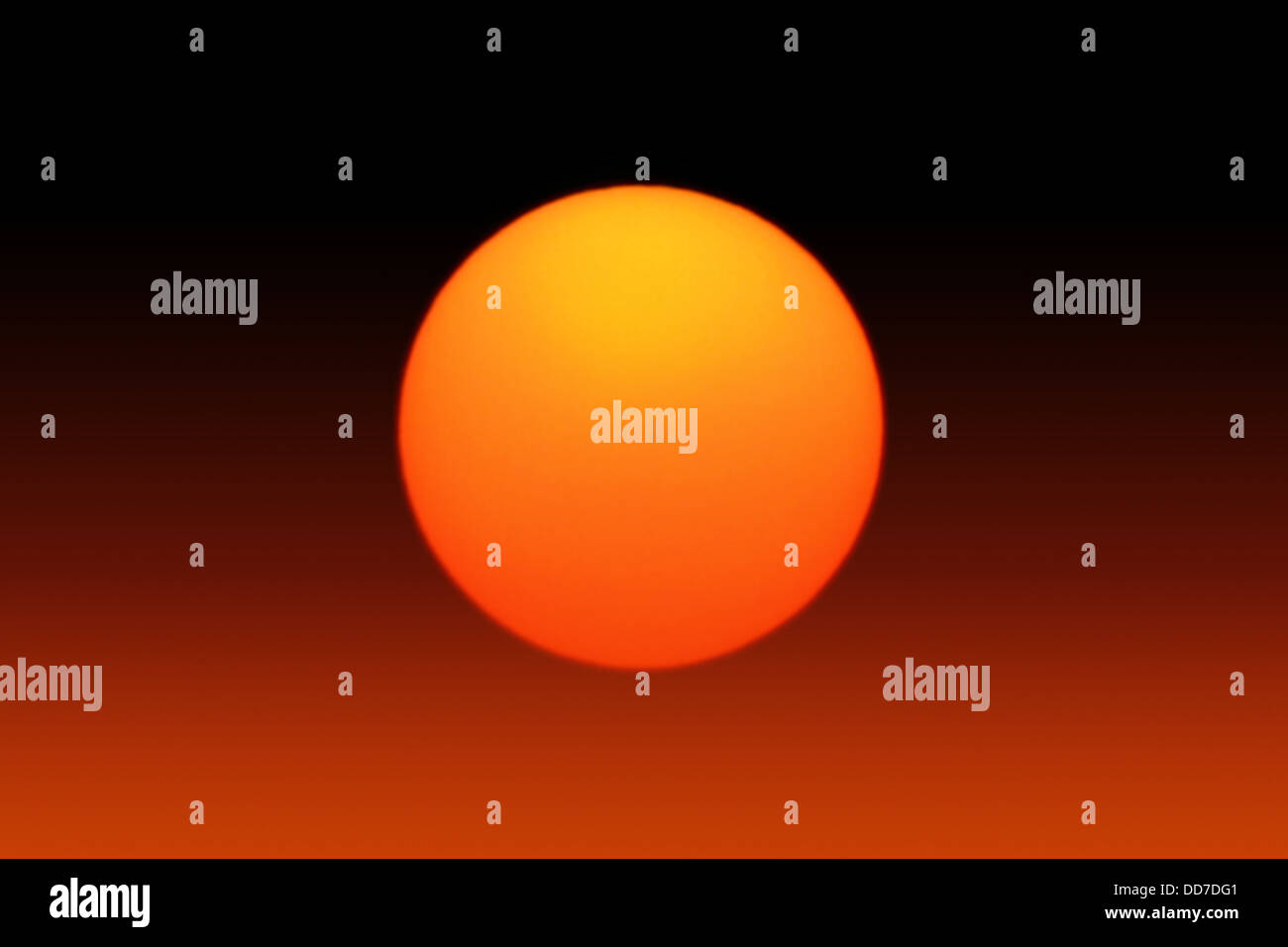 A Bright Orange Sun Background Stock Photo - Alamy