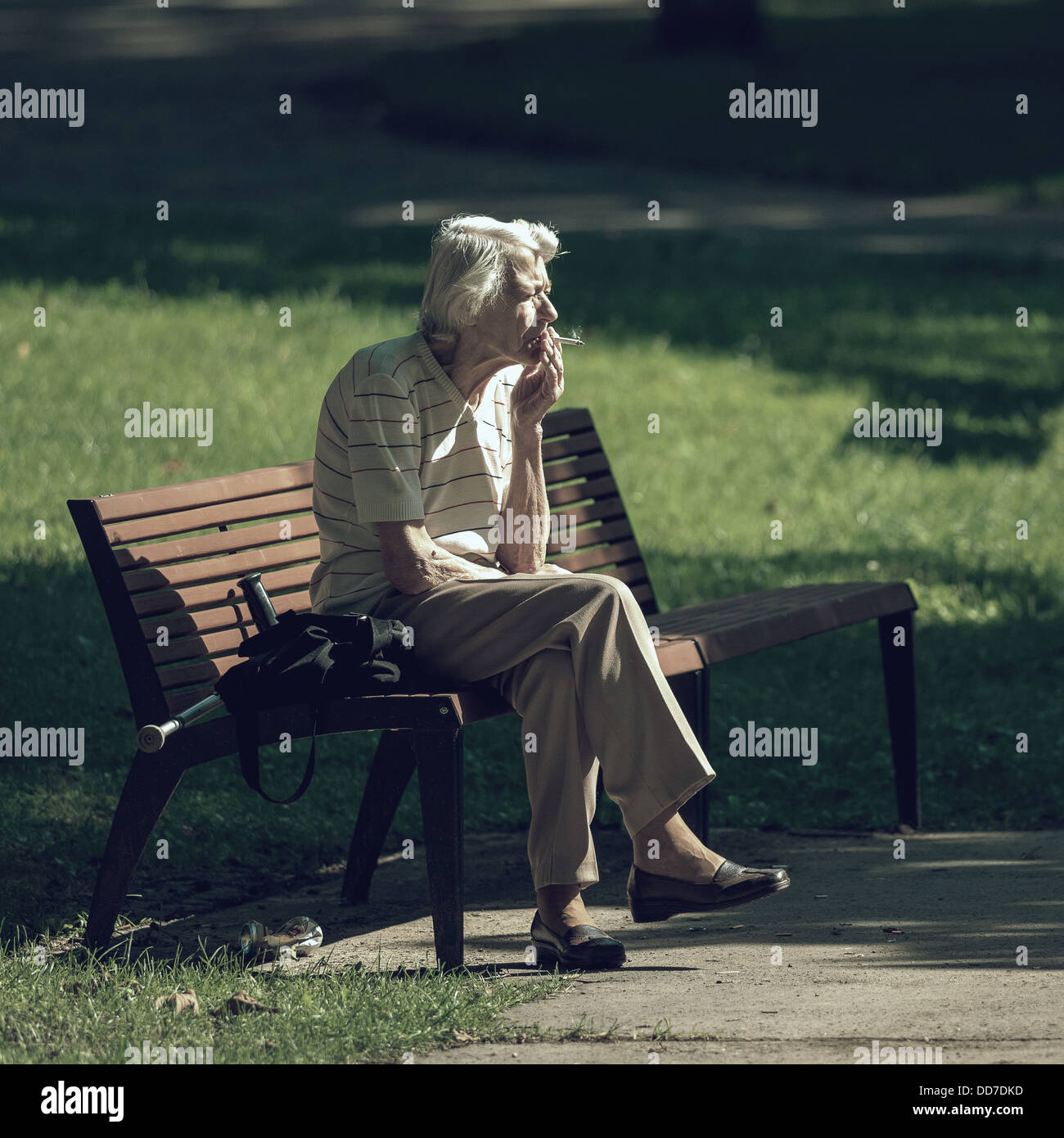 Old lady smoking cigarette hi-res stock photography and images - Alamy