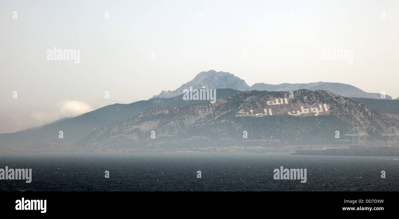 Arabic inscription in a mountain near the Tangier Med port, Morocco ...