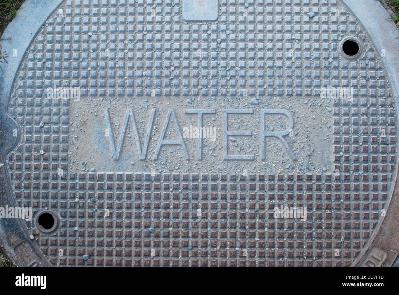 Old steel manhole cover plate over a water main valve in Spokane ...
