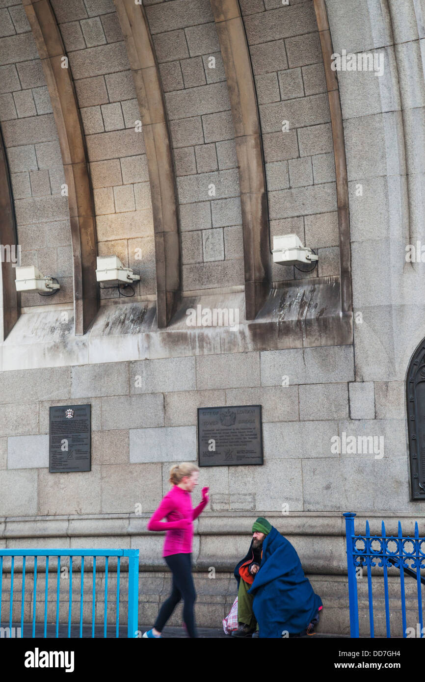 England, London, Southwark, Tower Bridge, Jogger Running Past Homeless ...