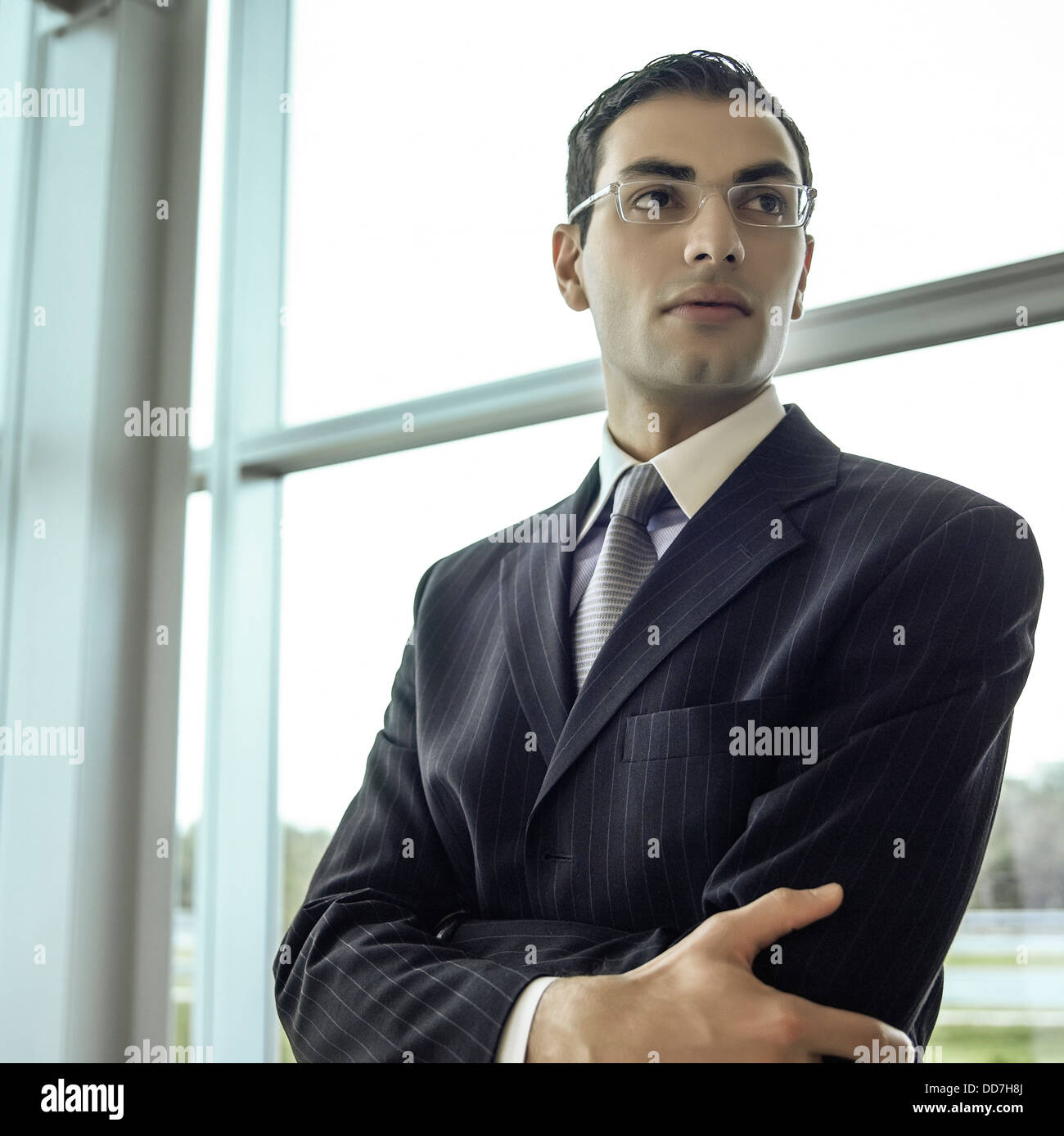 Middle Eastern businessman with arms crossed Stock Photo - Alamy