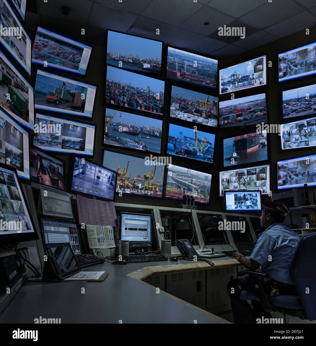 African American security officer working in control room Stock Photo ...