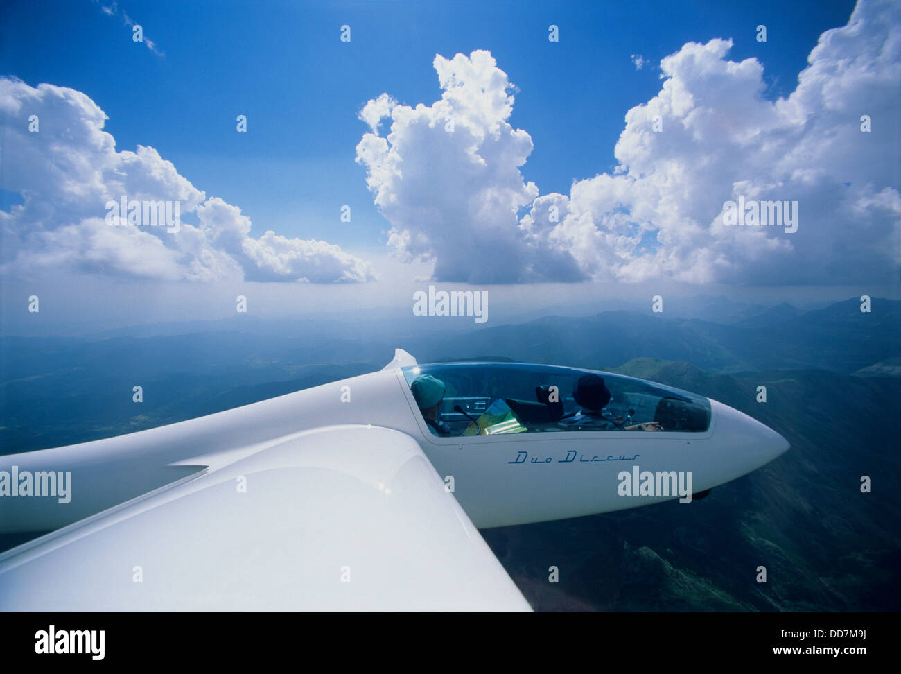 Glider plane Duo Discus flying over Pyrenees mountains, north of Jaca ...