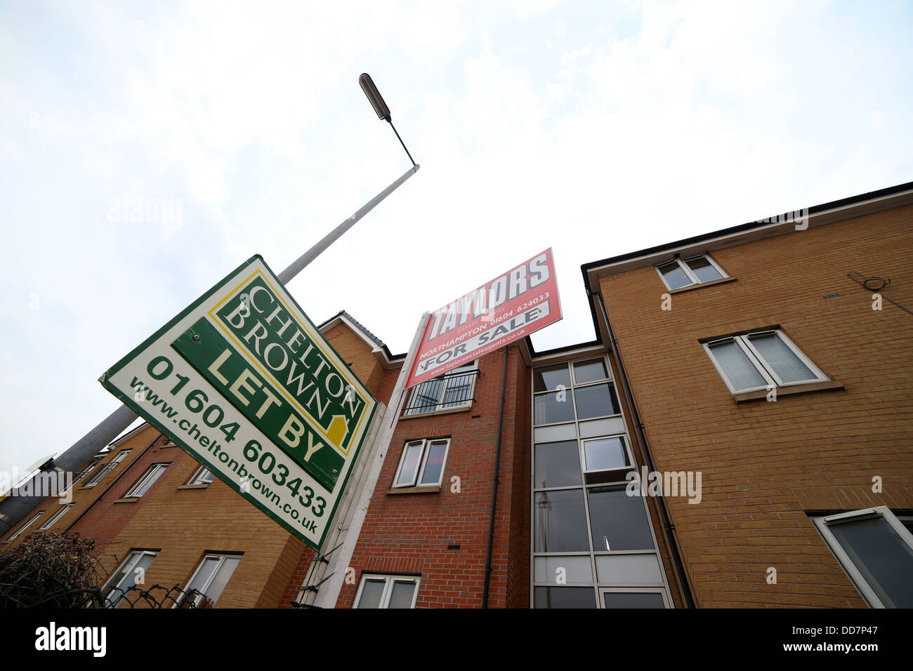 For sale signs outside flats Stock Photo - Alamy