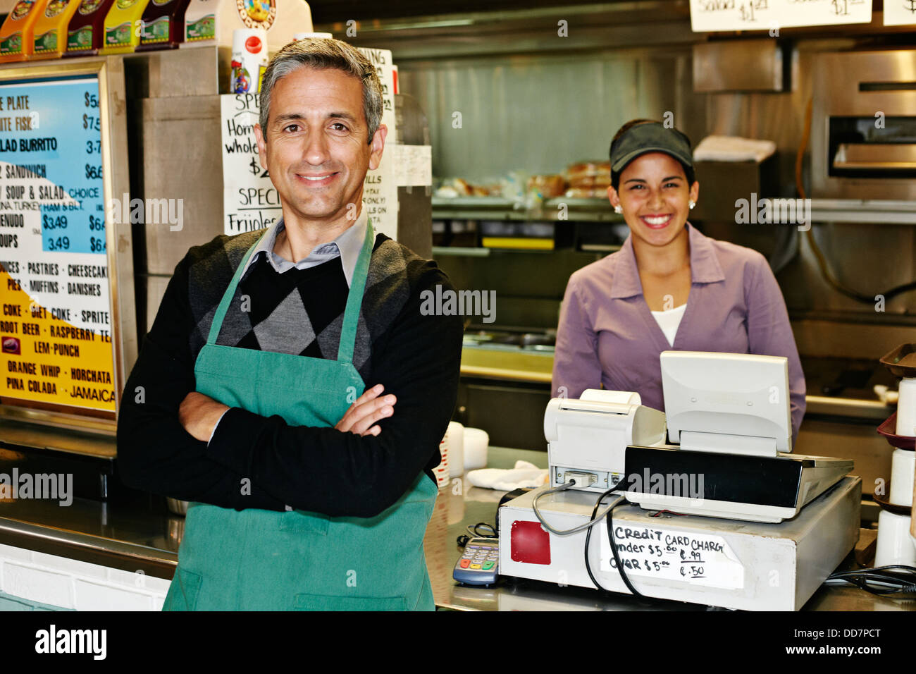 Hispanic servers smiling in restaurant Stock Photo - Alamy
