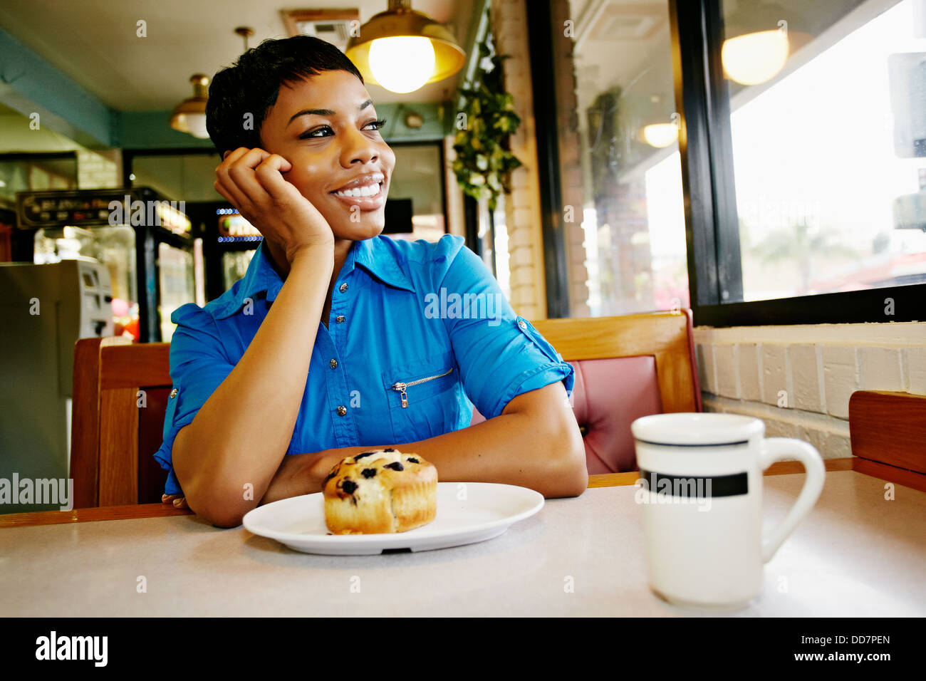 African woman eating breakfast in hi-res stock photography and images ...