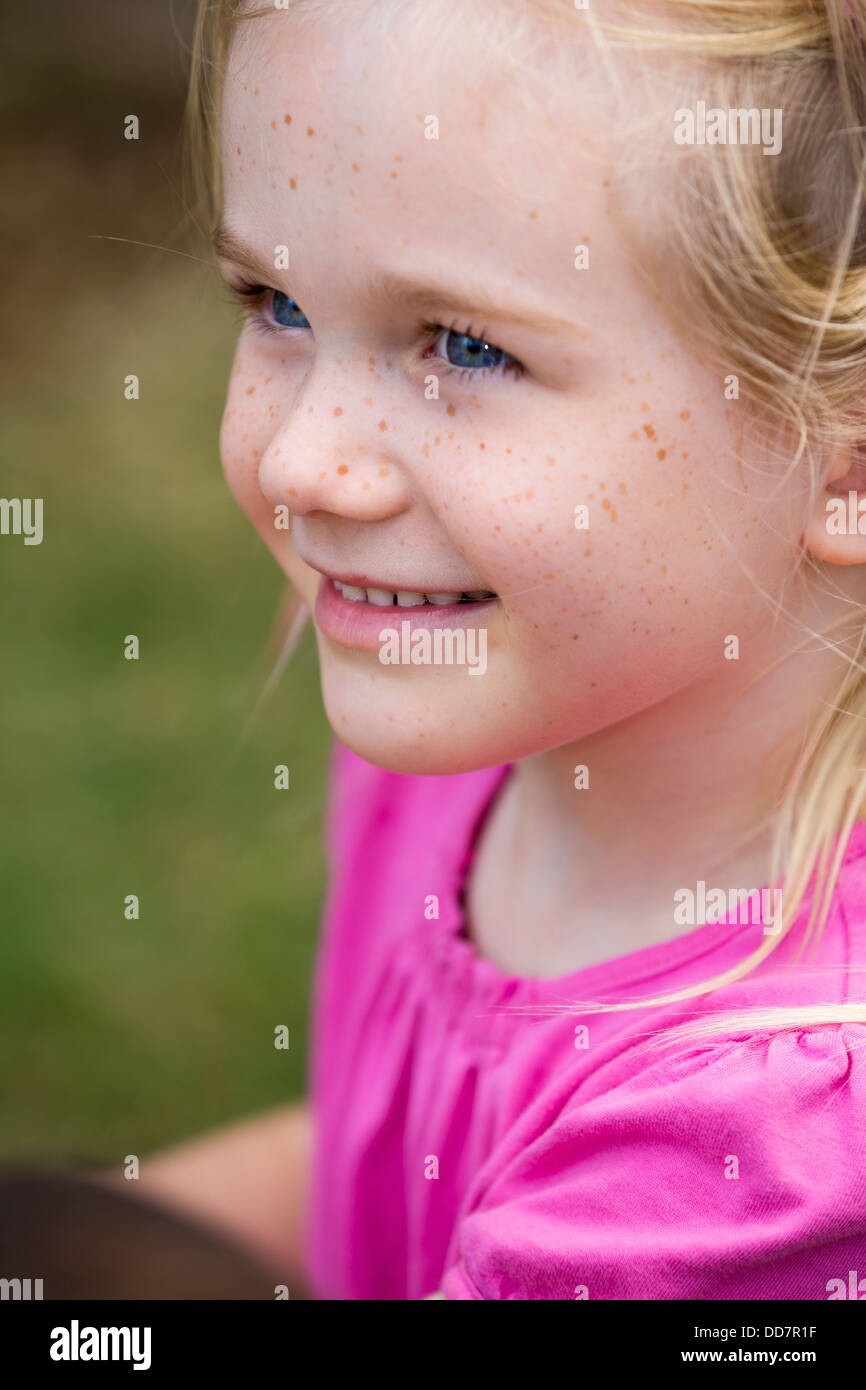 Close up of smiling girl's face Stock Photo - Alamy