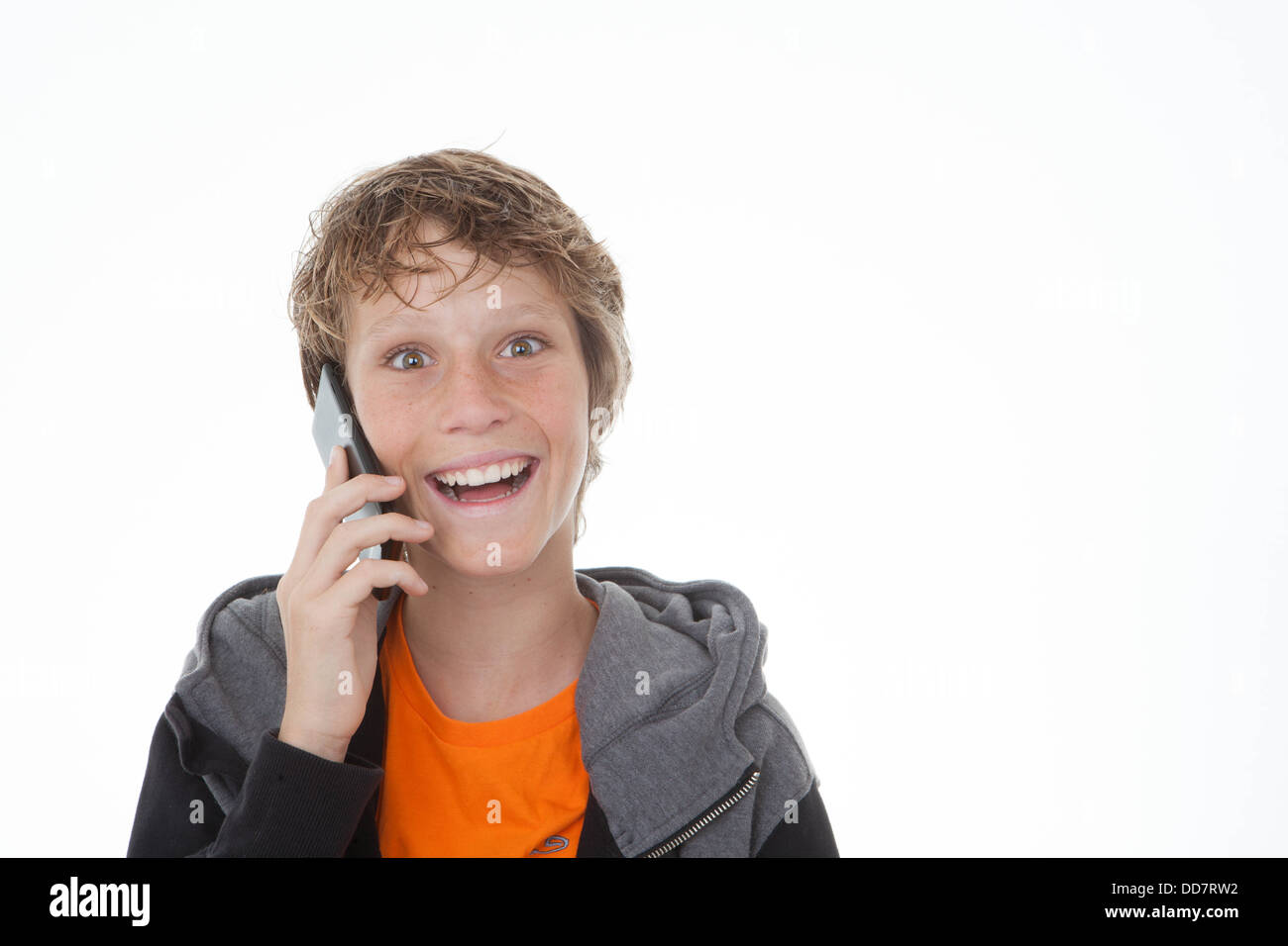 Teen boy on cell hi-res stock photography and images - Alamy