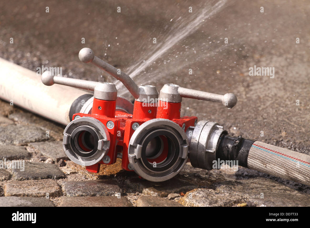 The close-up of hydrant and water hoses Stock Photo - Alamy