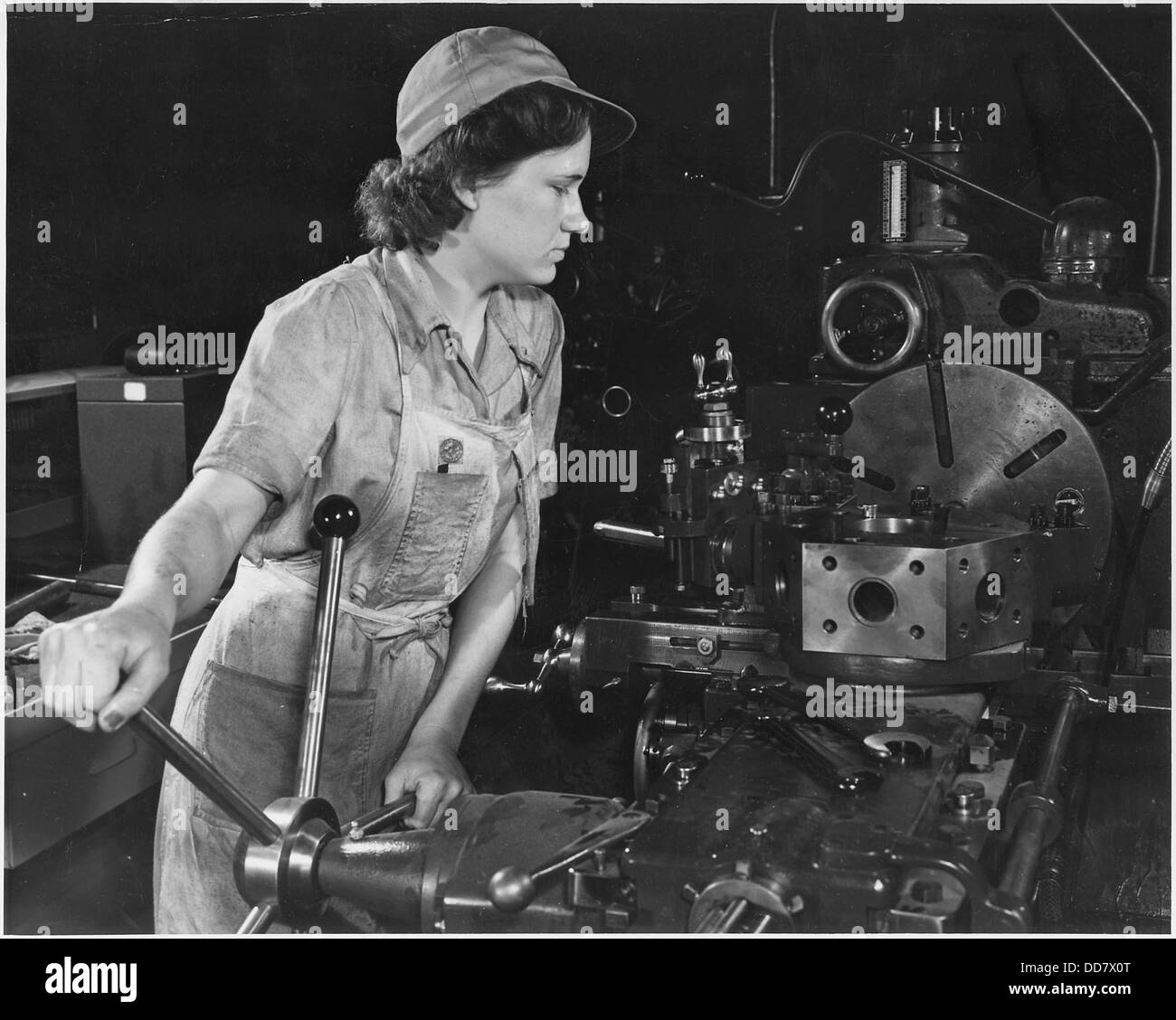 Grace Janota, once a department store clerk, now operates a lathe at a ...
