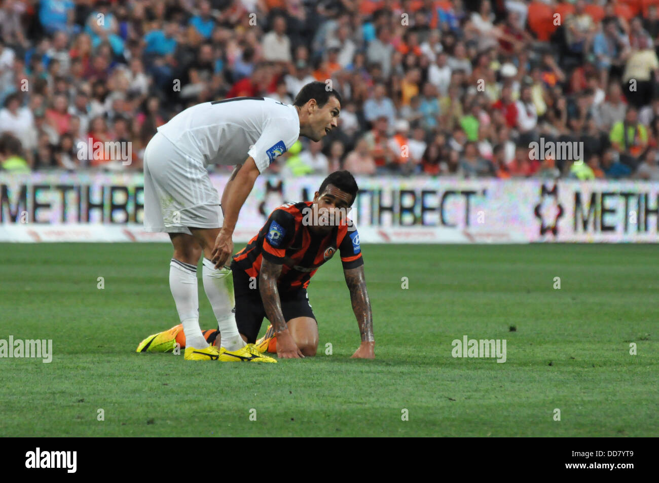 Two legs and football boots hi-res stock photography and images - Alamy