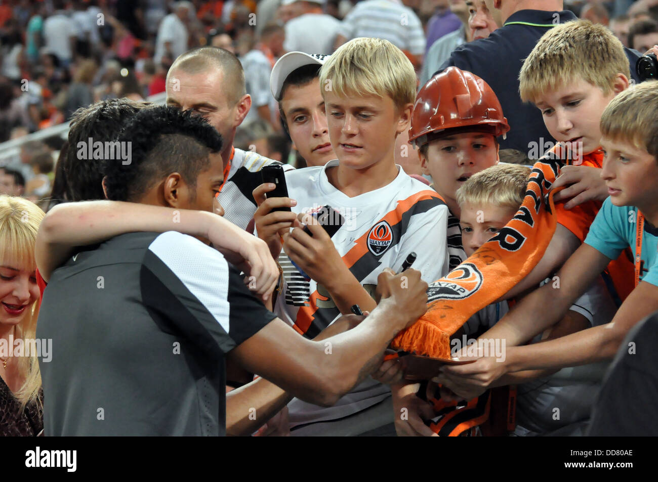 Football player giving an autograph to fans Stock Photo - Alamy