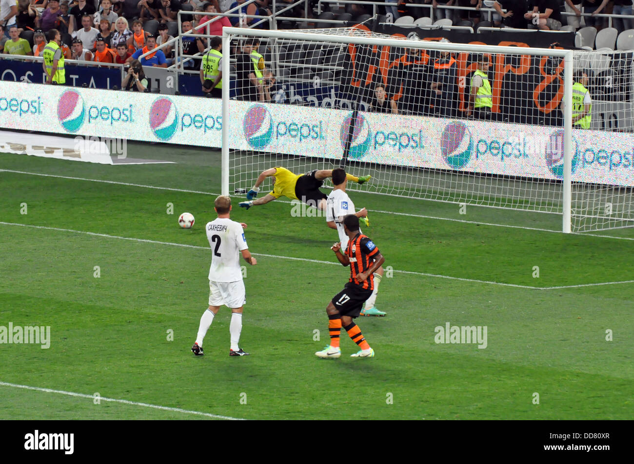 Goalkeeper jumping for the ball Stock Photo - Alamy