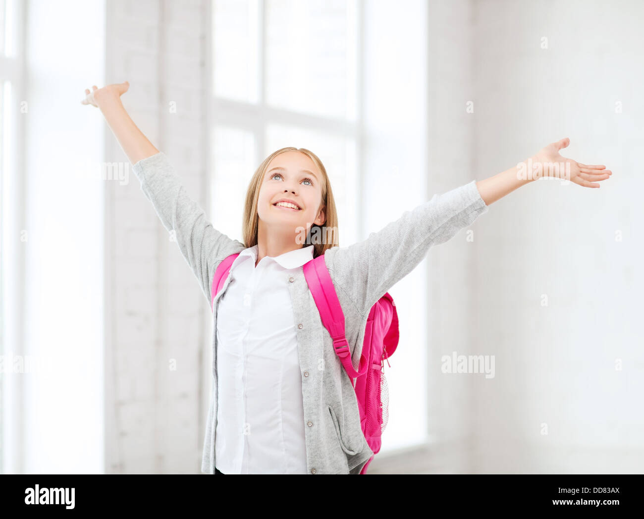 student girl with hands up at school Stock Photo - Alamy