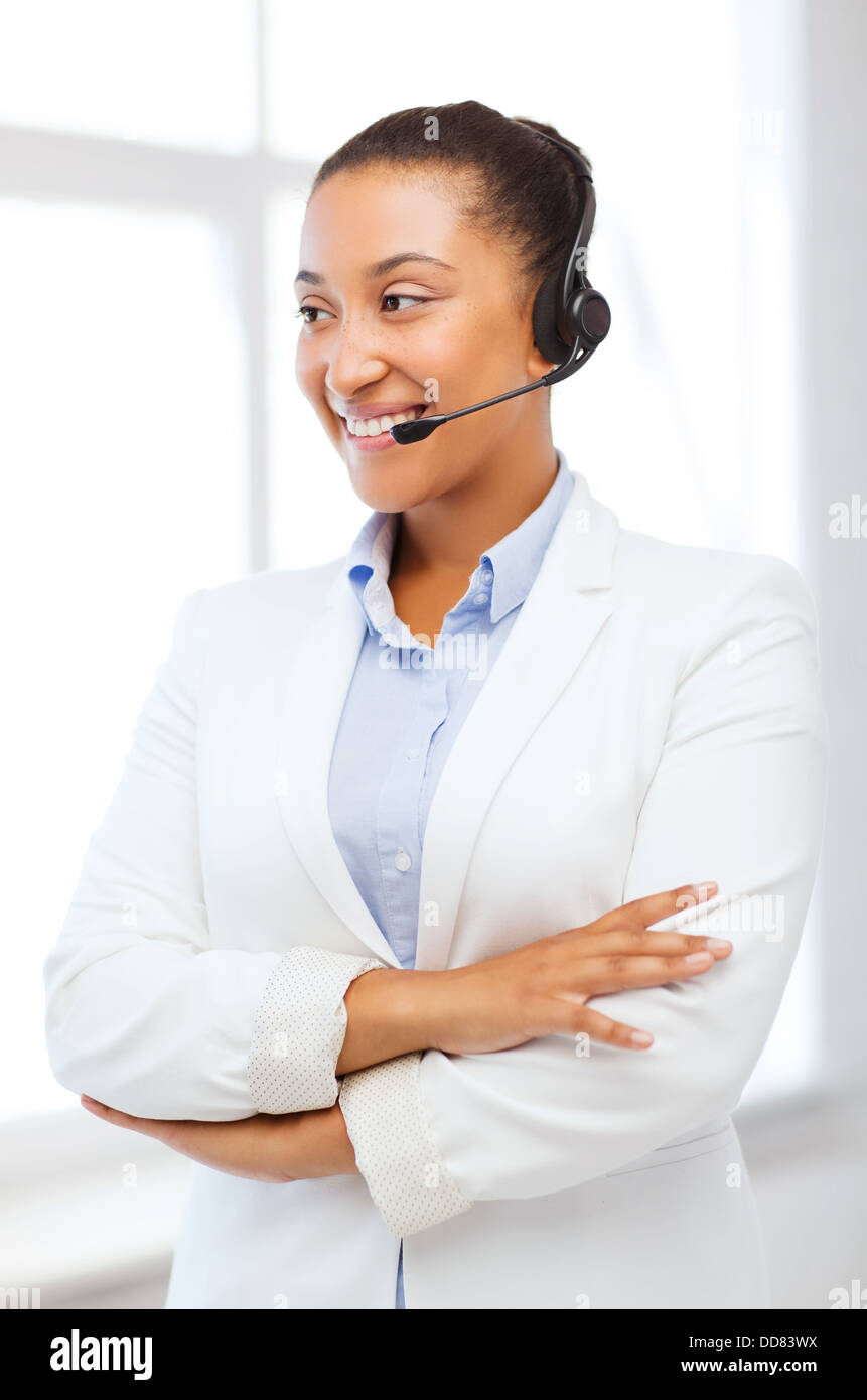 african helpline operator with headphones Stock Photo - Alamy