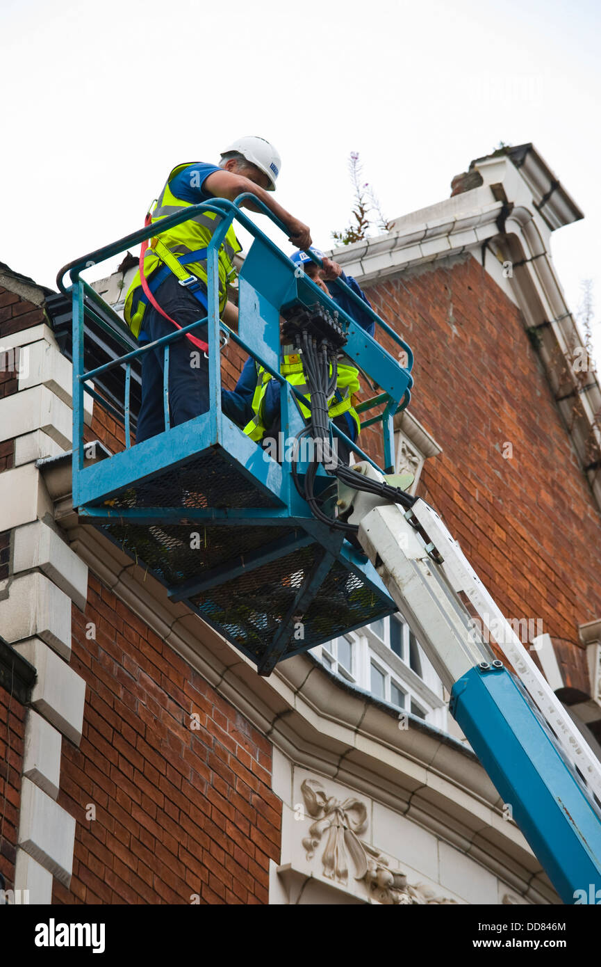 Contractors on high access platform making safe a building after being ...