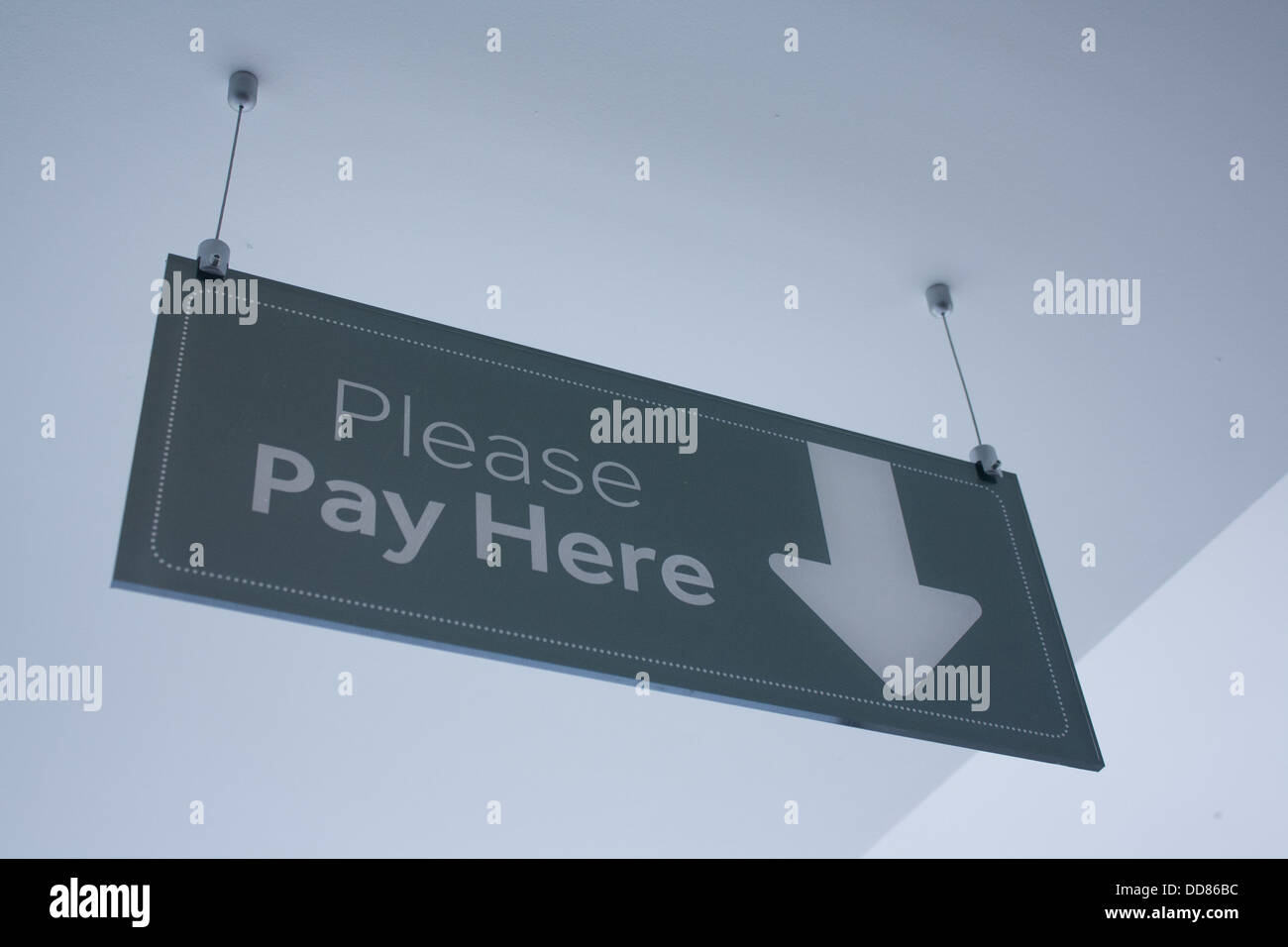 please pay here sign Stock Photo - Alamy