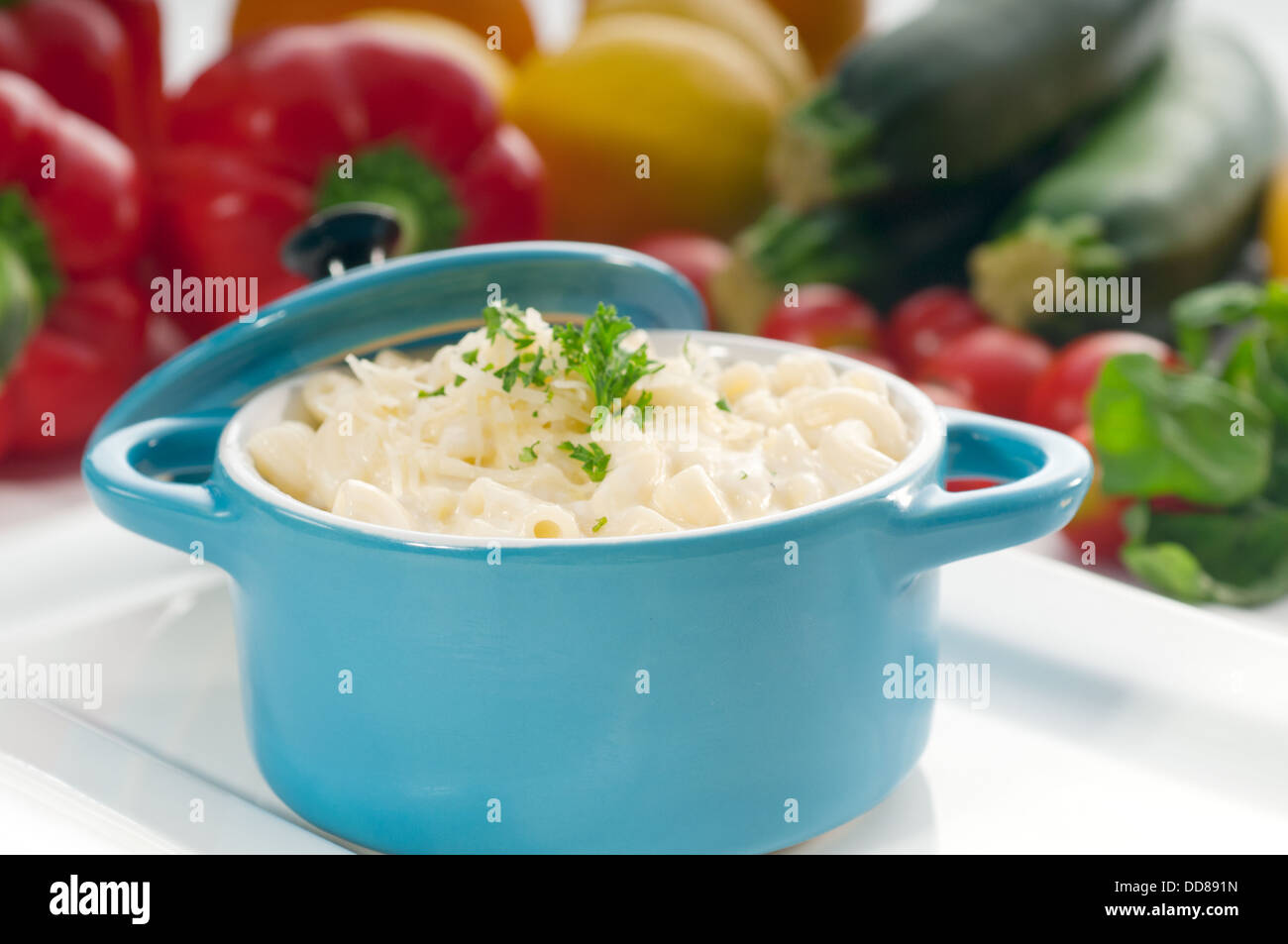 mac and cheese on a blue little clay pot Stock Photo - Alamy