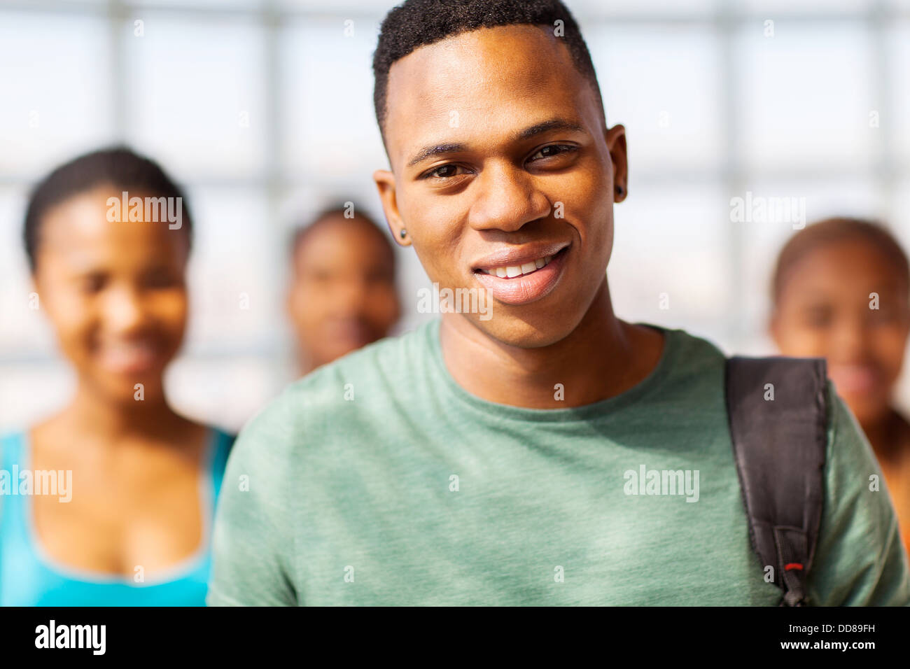 happy African college student with group of friends on background Stock ...