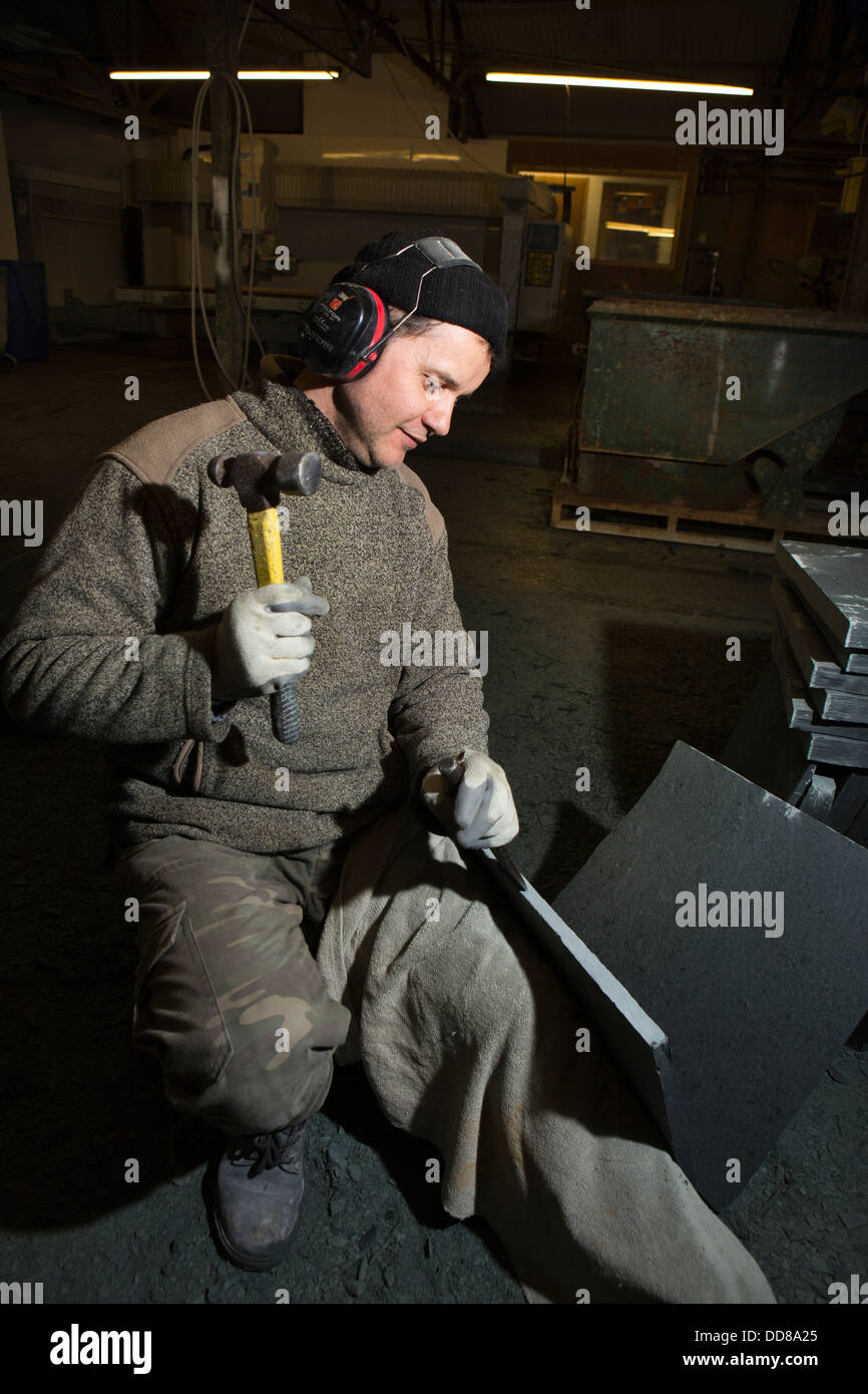 UK, Cumbria, Lake District, Honister Slate Mine, worker traditionally ...