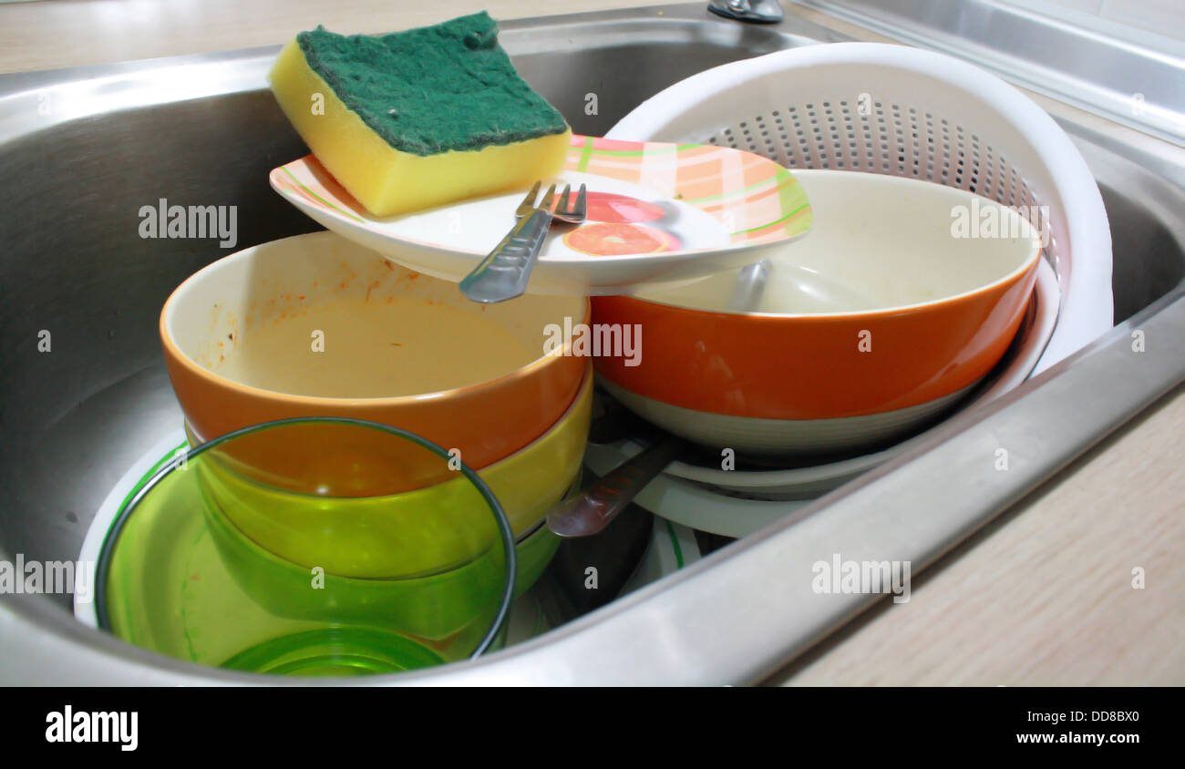 sink and dishes after dinner are waiting to watch Stock Photo - Alamy