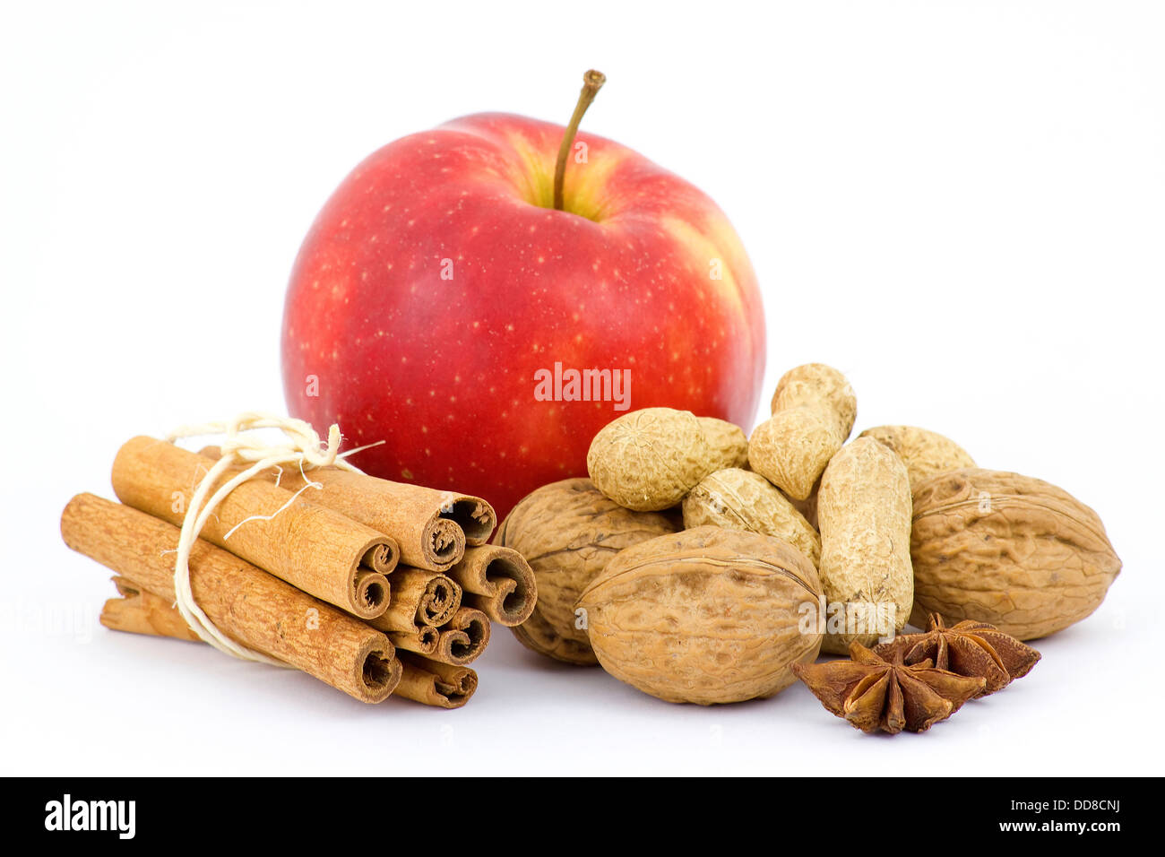 apple, cinnamon sticks and nuts Stock Photo - Alamy