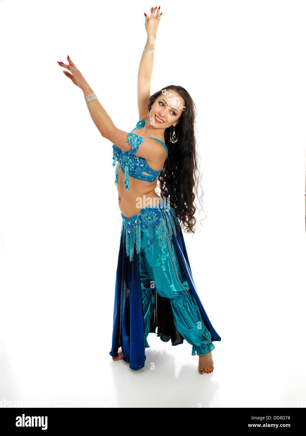 Beautiful professional bellydancer wearing colorful costume in front of ...
