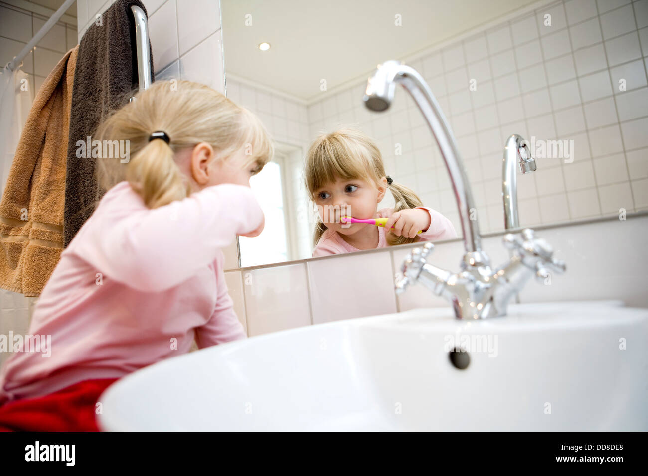 Baby Brushing teeth Stock Photo - Alamy