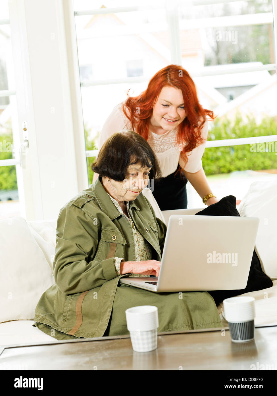 Women by the computer Stock Photo - Alamy
