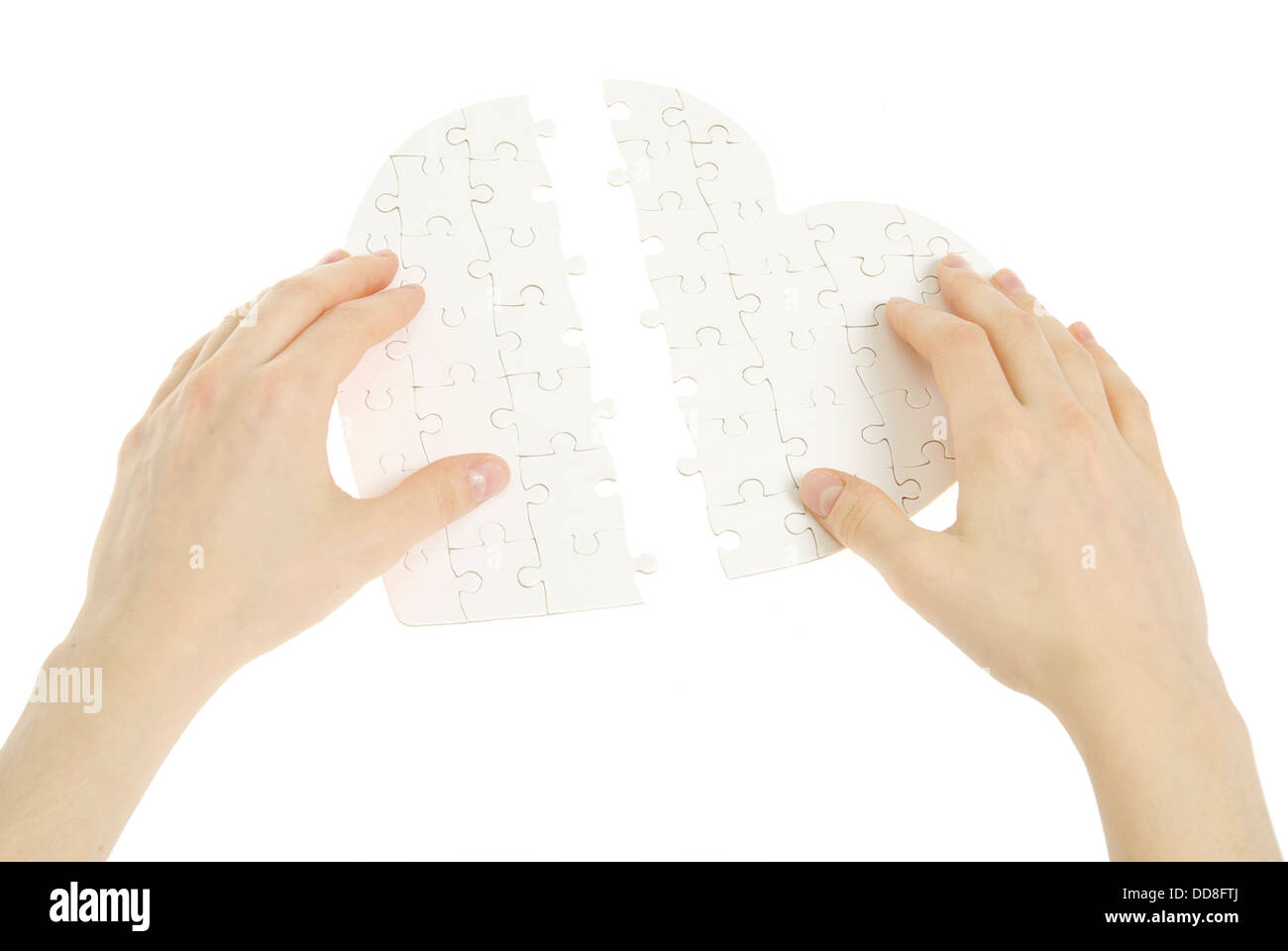 Heart puzzle hands hi-res stock photography and images - Alamy