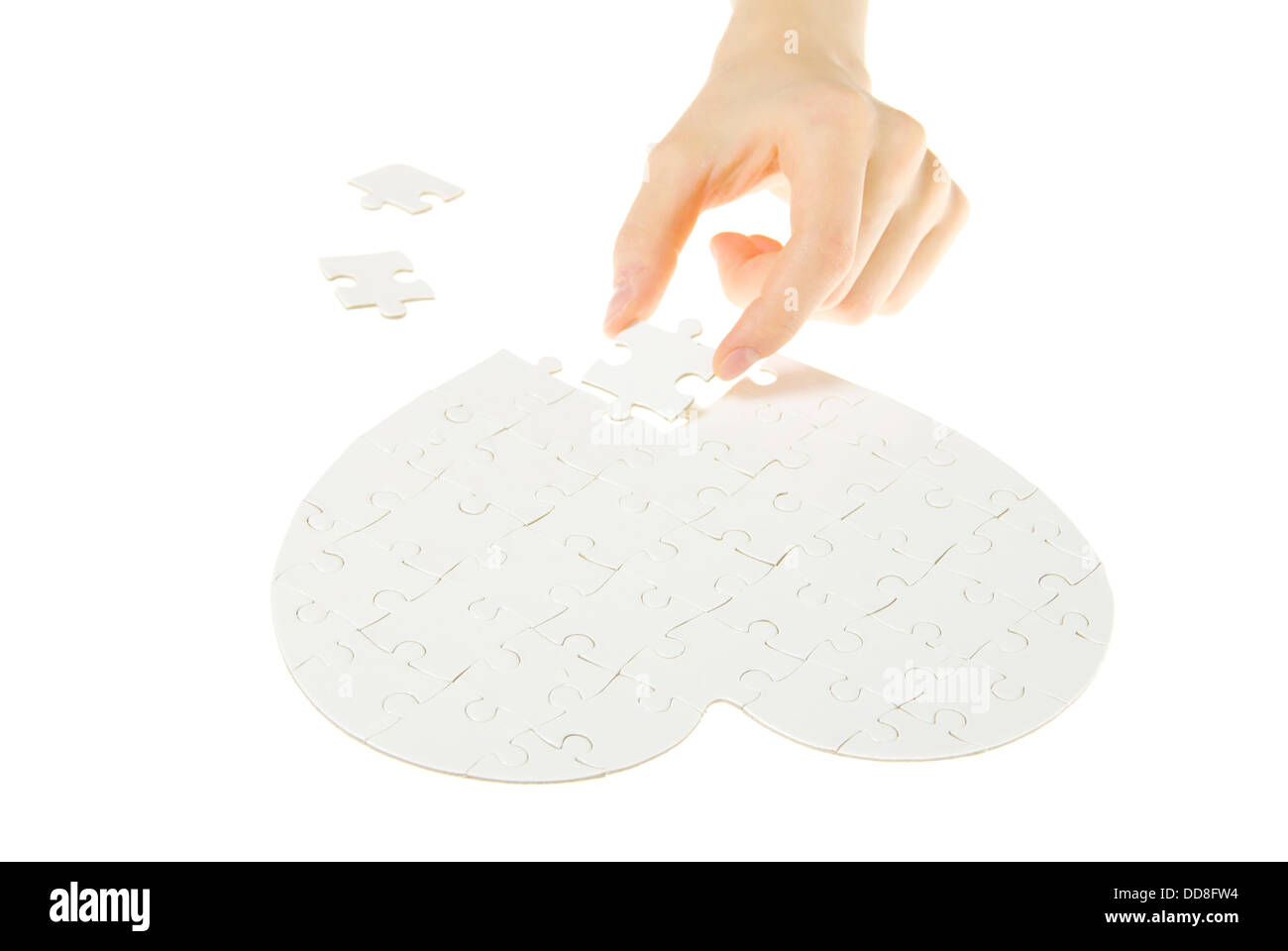 Heart puzzle hands hi-res stock photography and images - Alamy