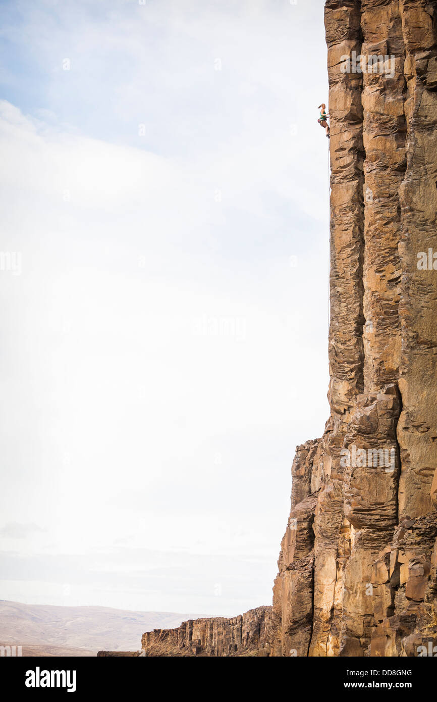 Woman climbing basalt rock hi-res stock photography and images - Alamy
