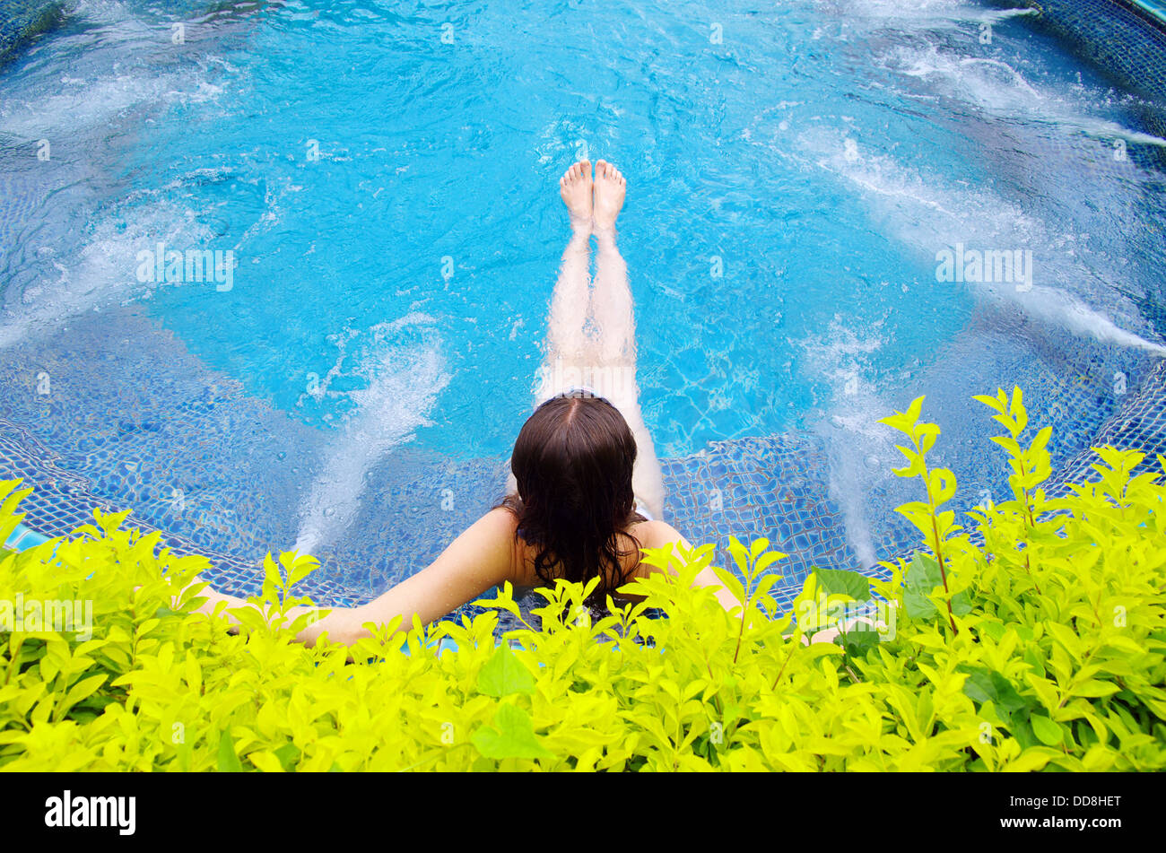 woman sitting in swimming pool Stock Photo - Alamy