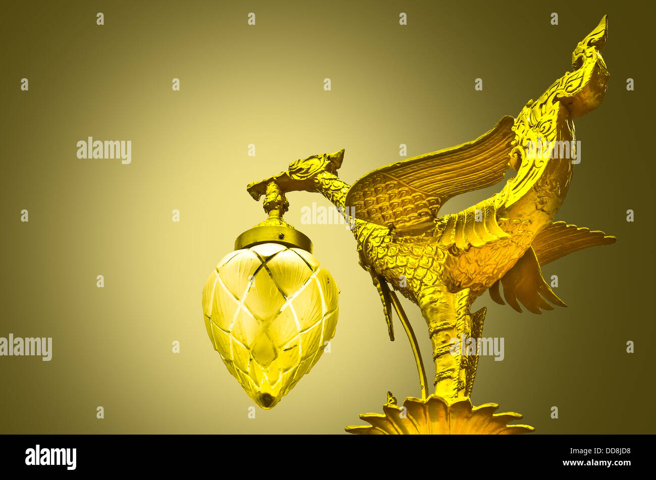 Golden swan sculpture on yellow background Stock Photo - Alamy