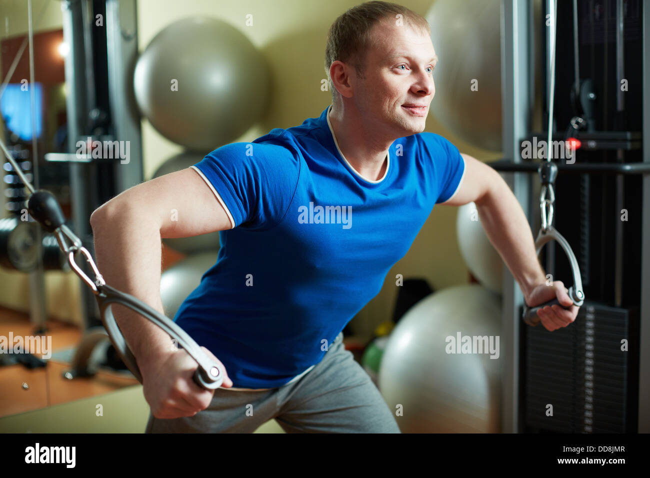 Happy man working out in the gym Stock Photo - Alamy