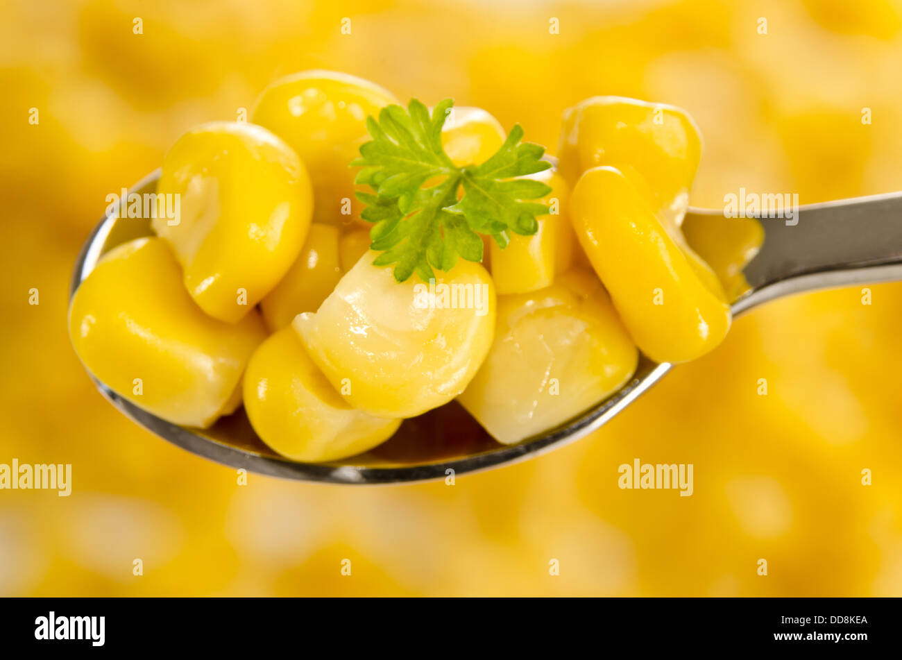 golden sweet corn on a small spoon Stock Photo - Alamy