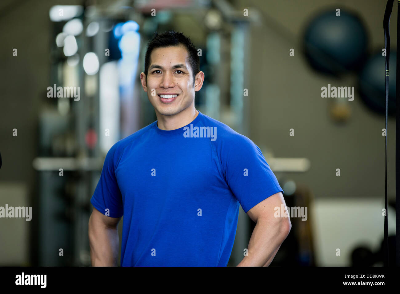 Pacific Islander man smiling in gym Stock Photo - Alamy