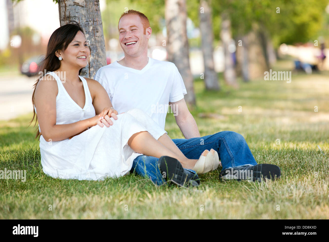 Multicultural young couple resting in hi-res stock photography and ...