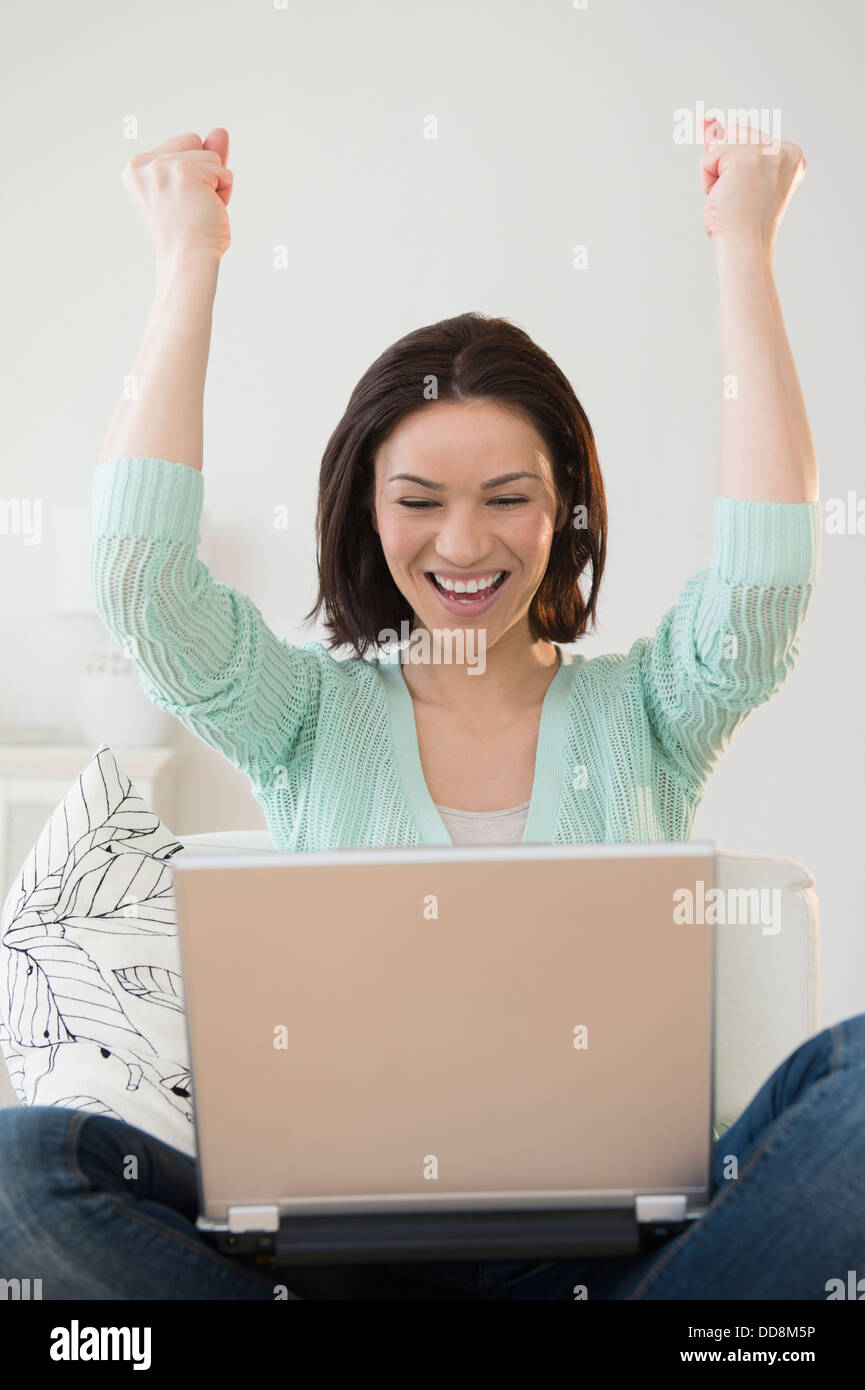 Happy woman computer arms hi-res stock photography and images - Alamy