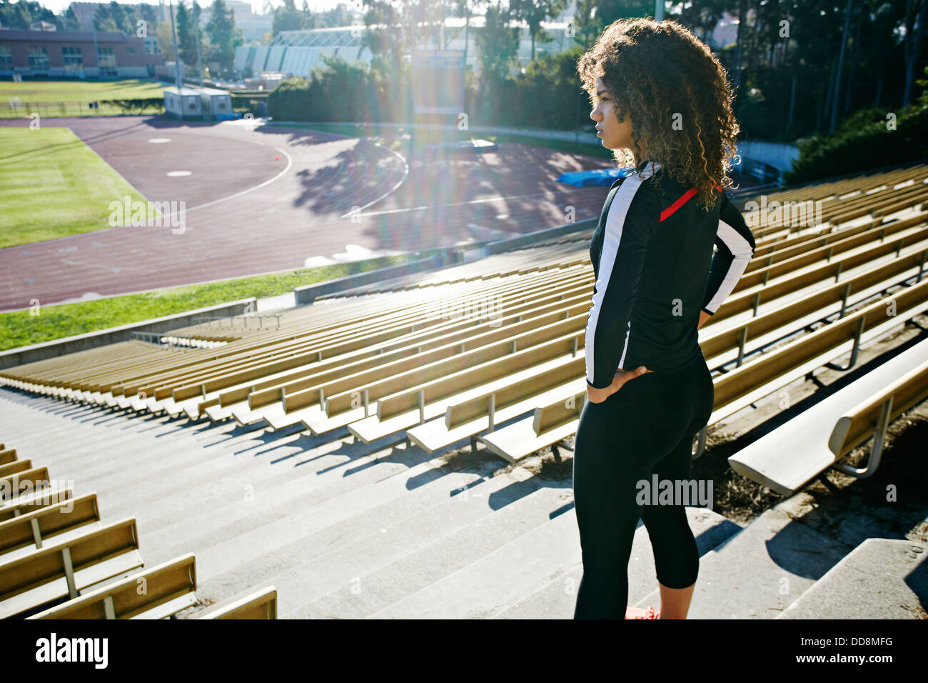 Mixed race runner training in stadium Stock Photo - Alamy