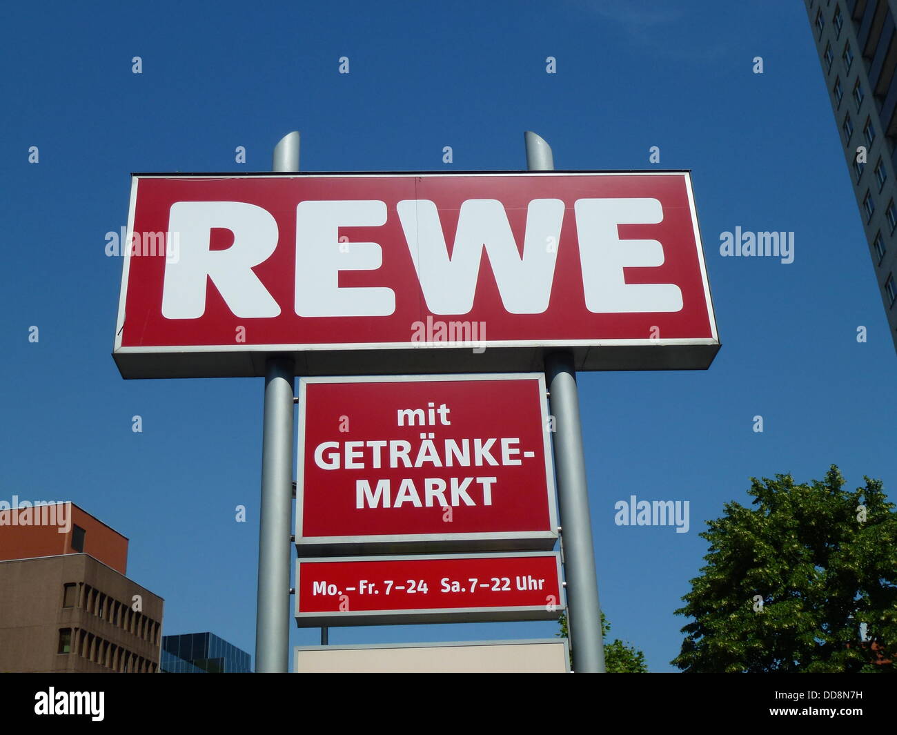 Logo of a REWE store with new opening hours, on 21 July 2013, in ...