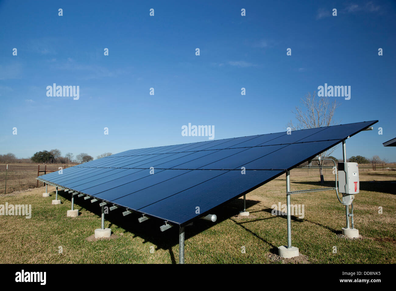 Solar panels in rural field Stock Photo - Alamy