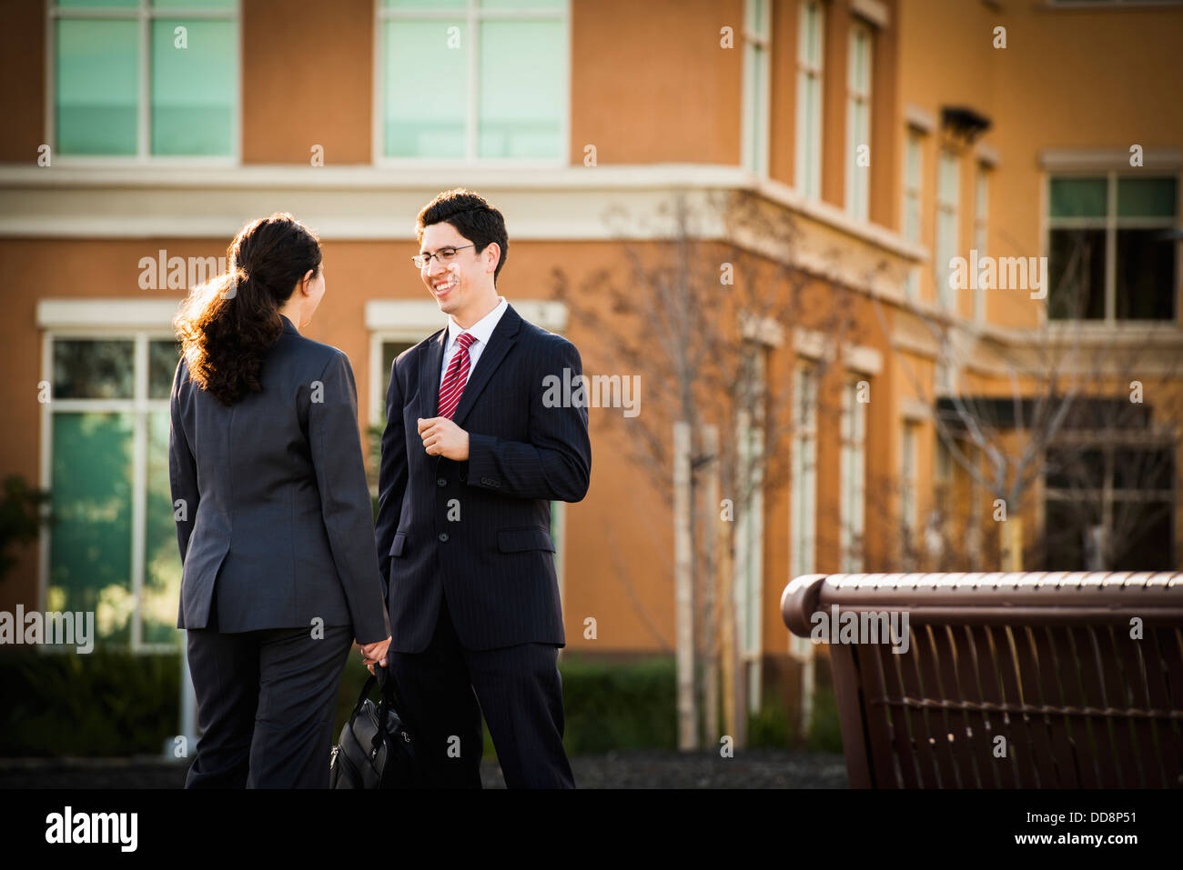 Hispanic business people talking outdoors Stock Photo - Alamy