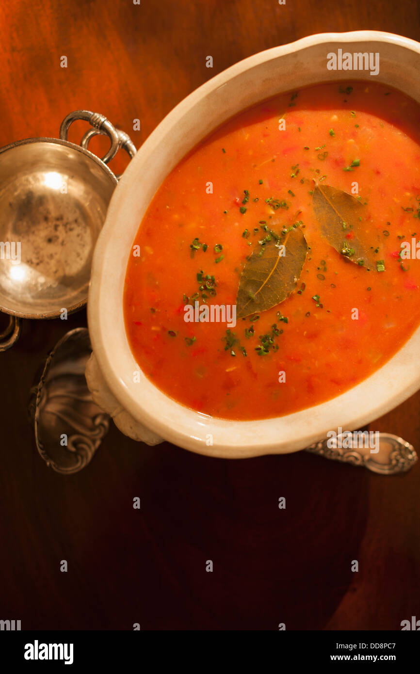 Bowl of soup on table Stock Photo - Alamy